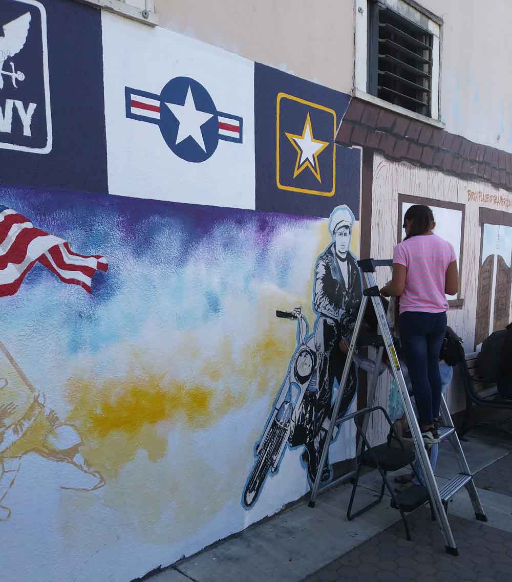 Artist puts new touches on Whiskey Creek biker mural | San Benito Live